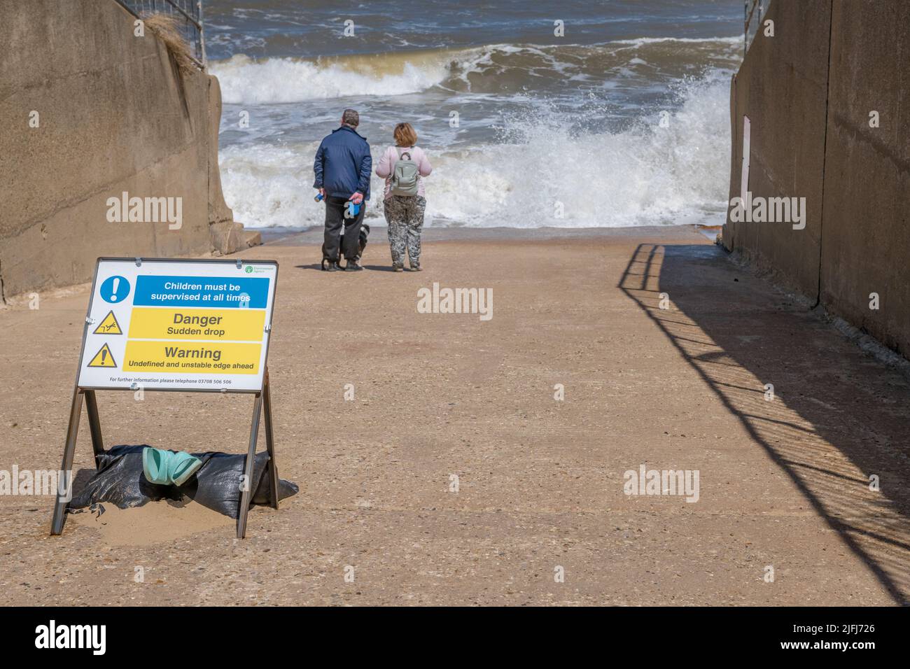 Enviromental agency warning and danger sign at Horsey Gap sea defences ...