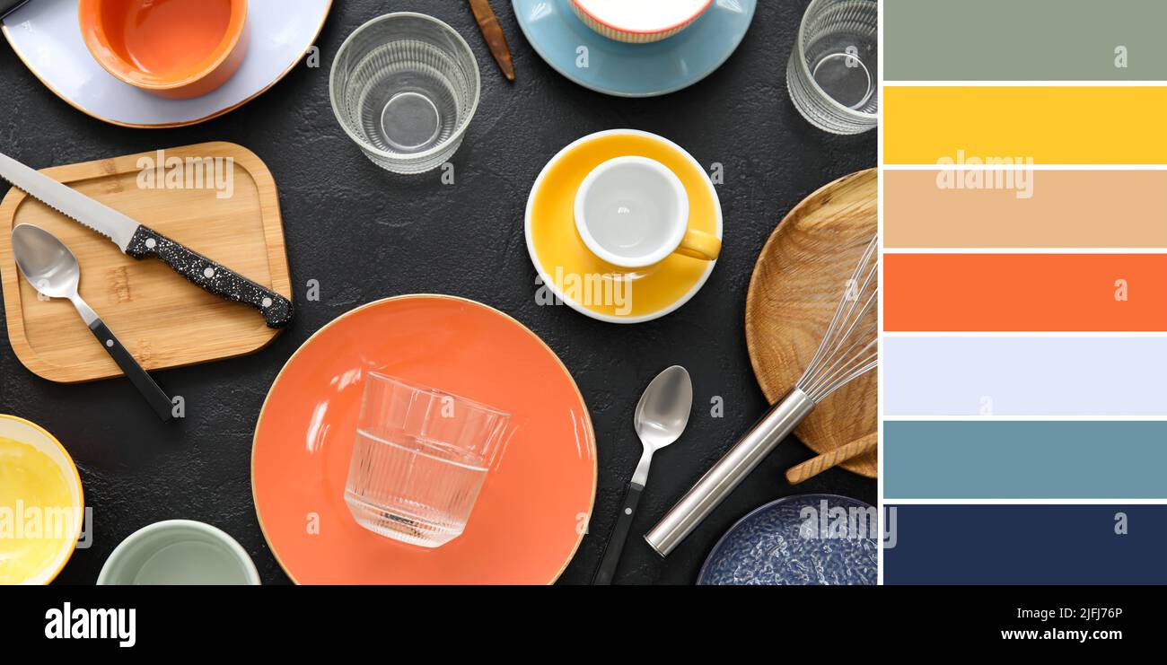 Many tableware and kitchenware on dark background. Different color ...
