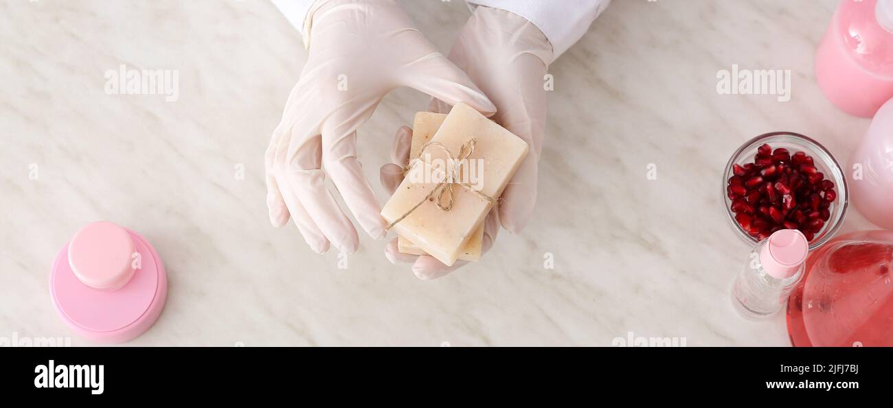 Beautician with natural soap bars in laboratory, top view Stock Photo ...