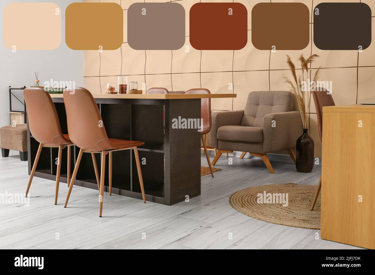 Stylish table with brown chairs in light dining room. Different color ...