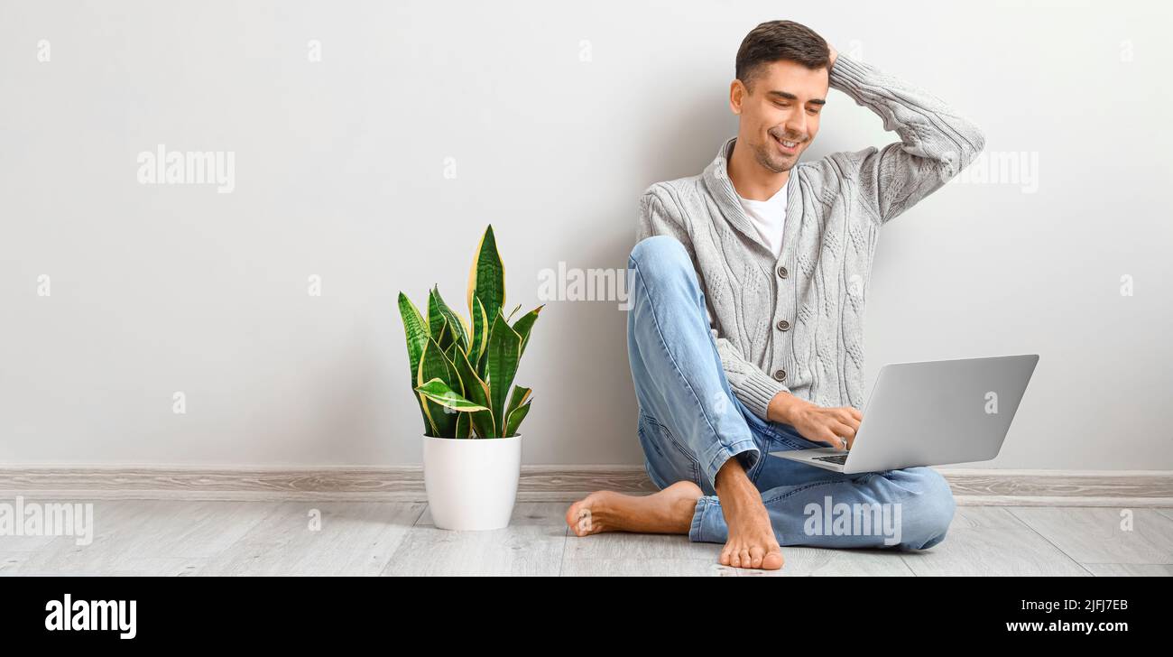 Young guy sitting home barefoot hi-res stock photography and images - Alamy