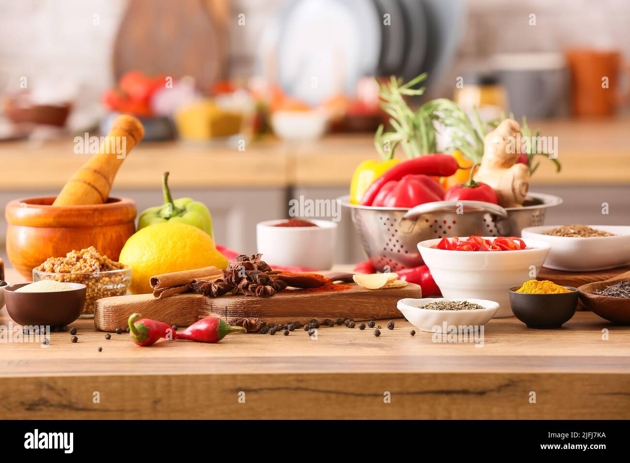 Different spices and products on table in kitchen Stock Photo - Alamy