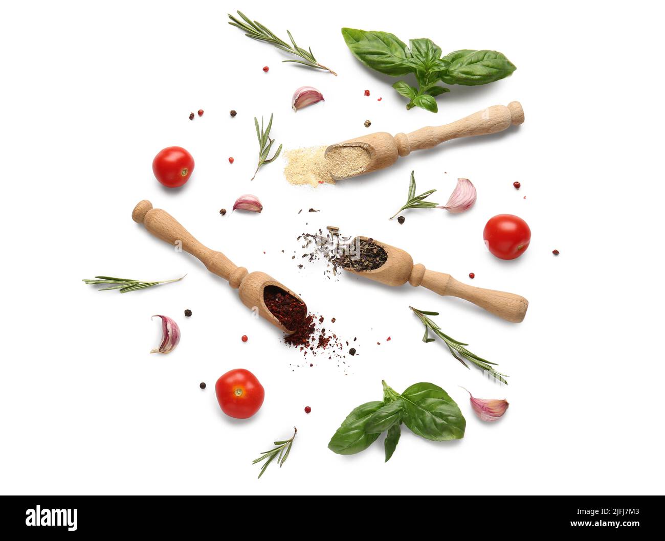 Wooden scoops with spices, vegetables and herbs on white background ...