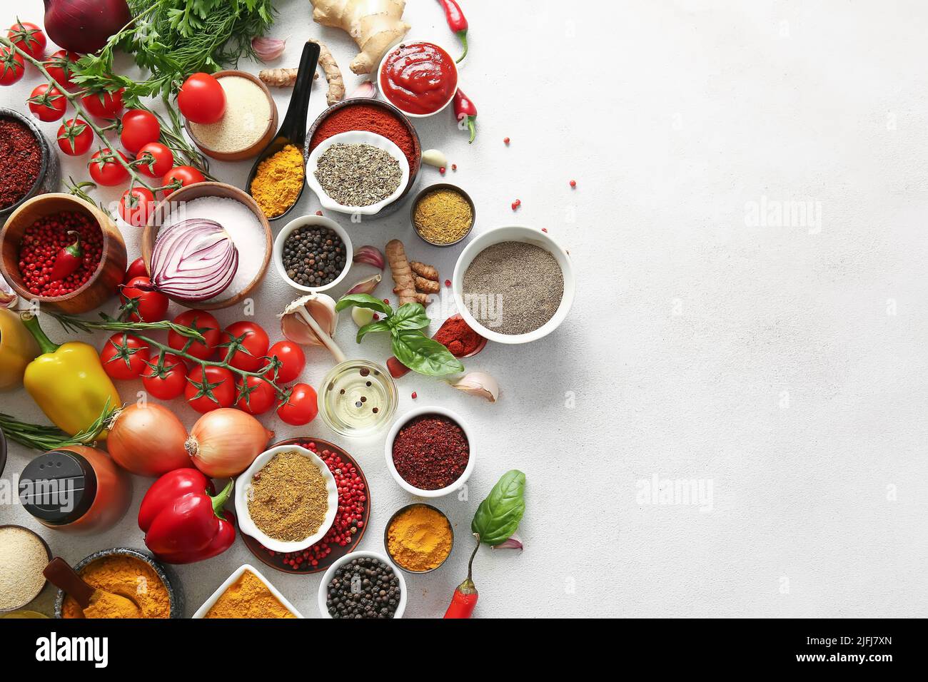 Composition with aromatic spices and vegetables on light background ...