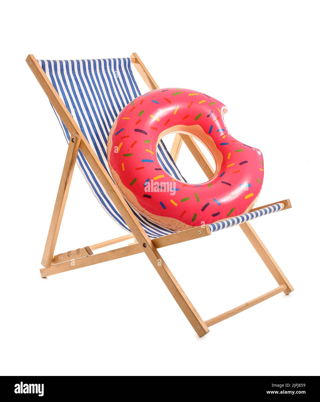 Striped deck chair with inflatable ring on white background Stock Photo ...