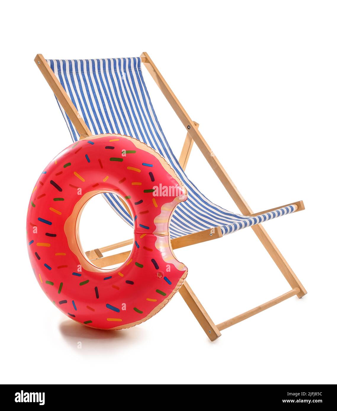 Striped deck chair with inflatable ring on white background Stock Photo ...