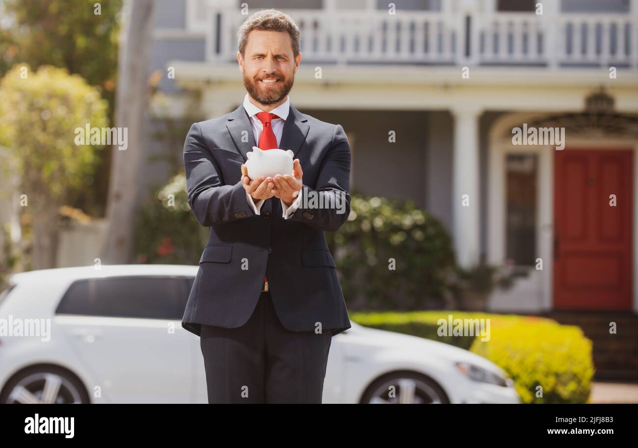 Man saving money. Businessman holding a coin bank. Finance Savings ...