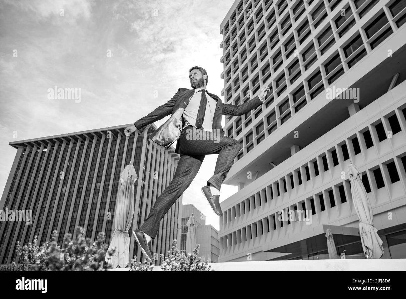 Businessman running. Business man in formal wear while running and jump ...