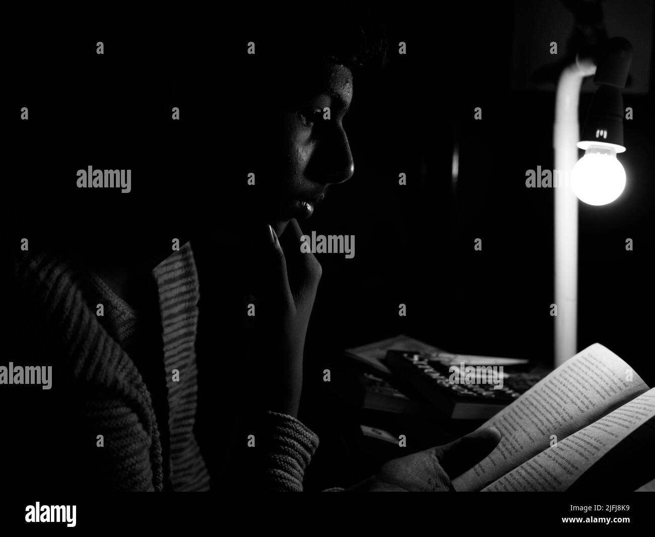 Teenager reading a book Black and White Stock Photos & Images - Alamy