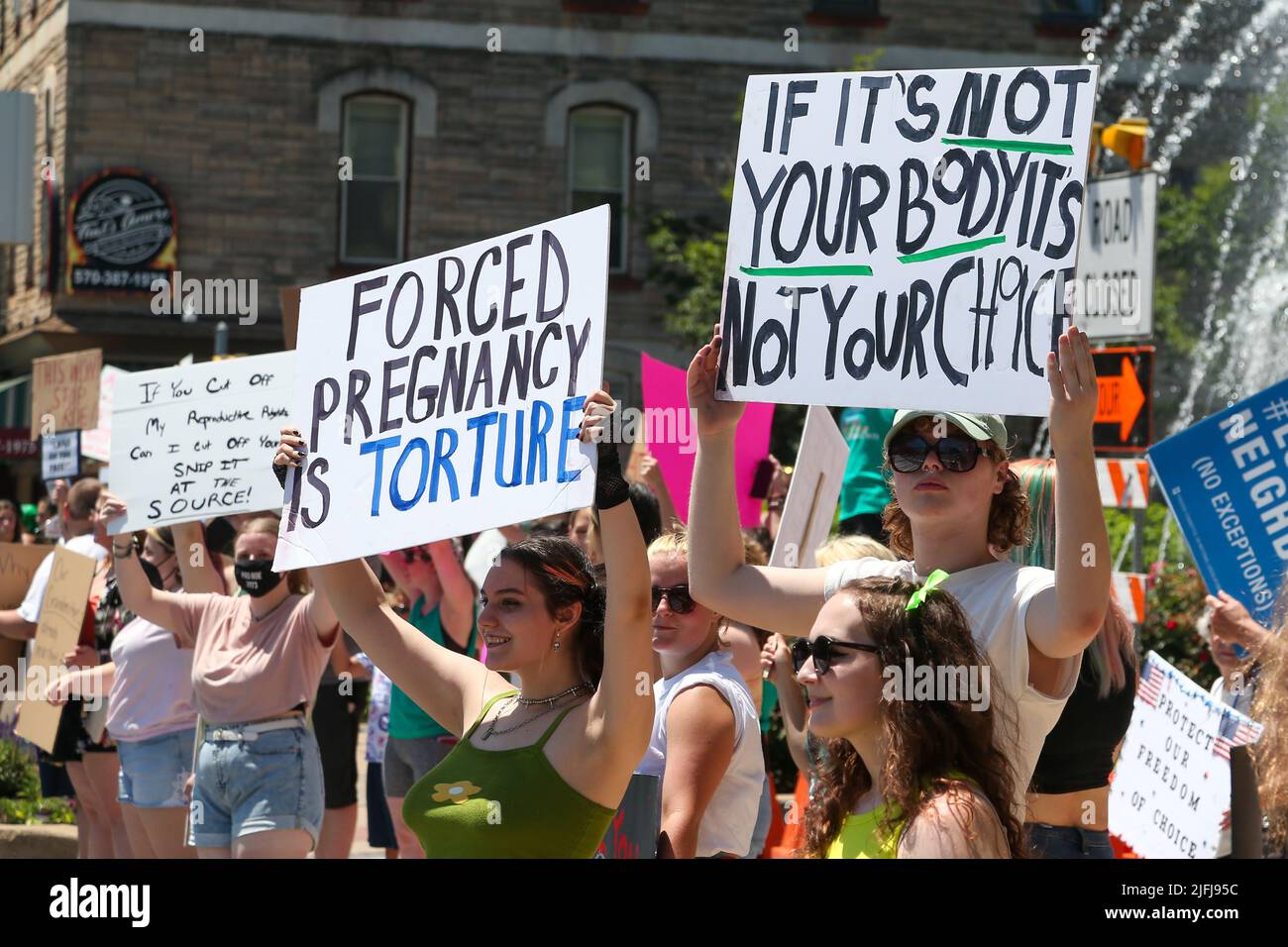 People hold signs during an abortion rights rally in Bloomsburg ...