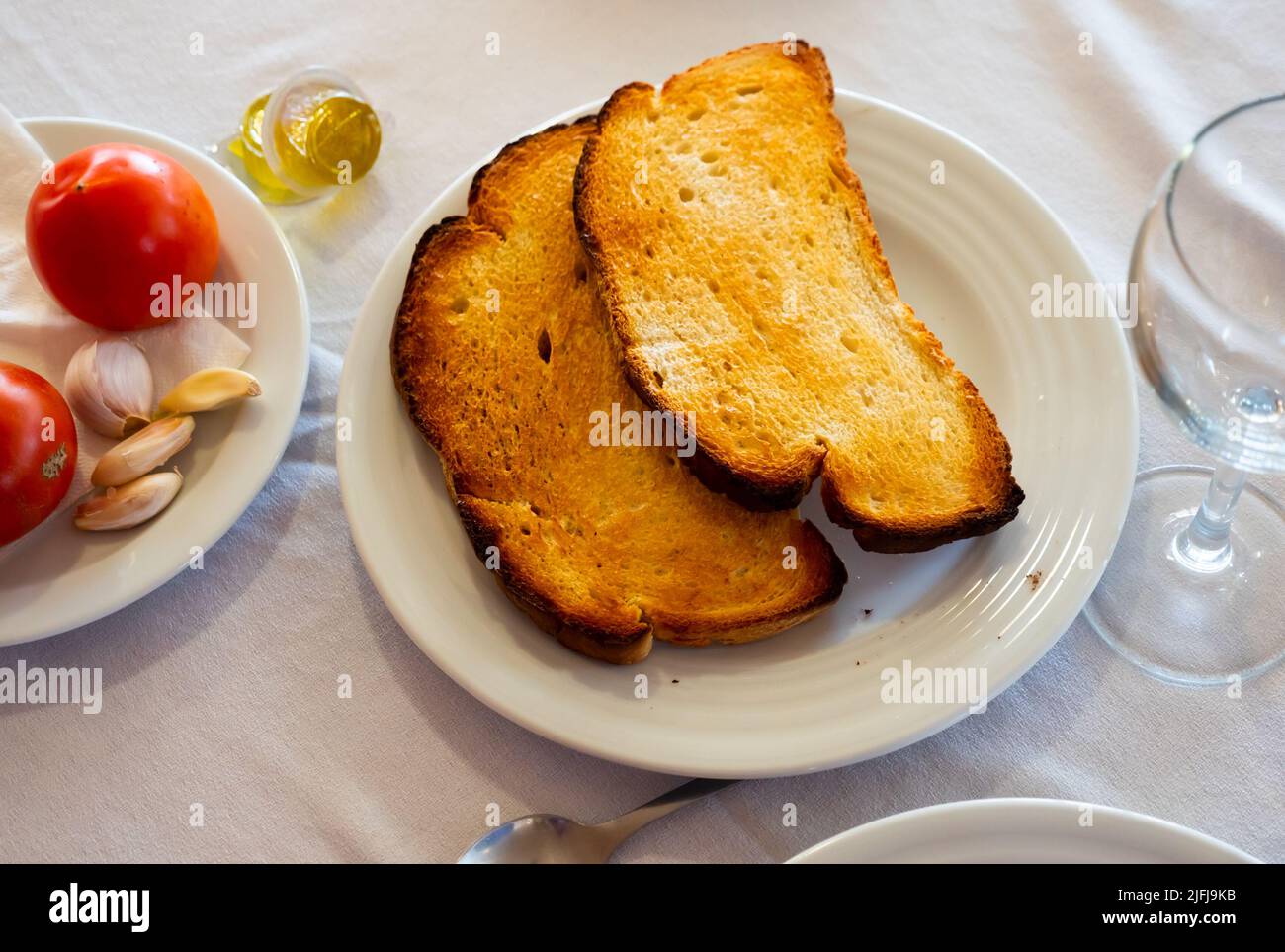 Traditional Catalan dish, pan con tomate, served on table Stock Photo ...