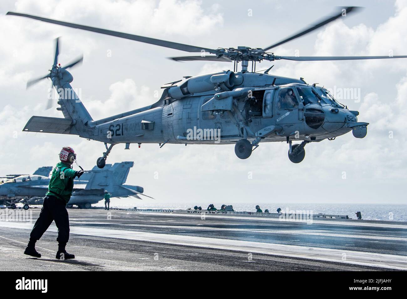 220701-N-BR419-1020 PHILIPPINE SEA (July 1, 2022) An MH-60S Sea Hawk ...