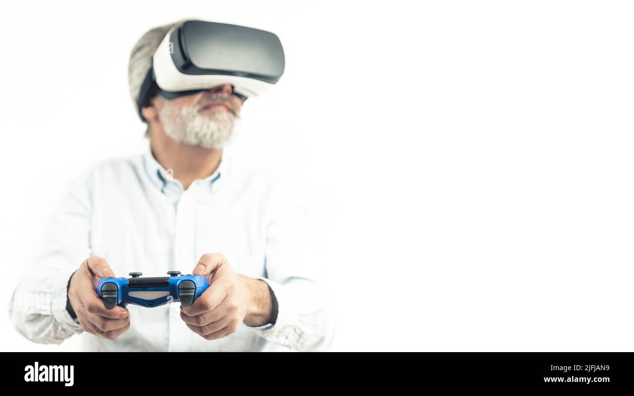 Middle-aged man wearing Virtual Reality set - VR goggles. Isolated on ...