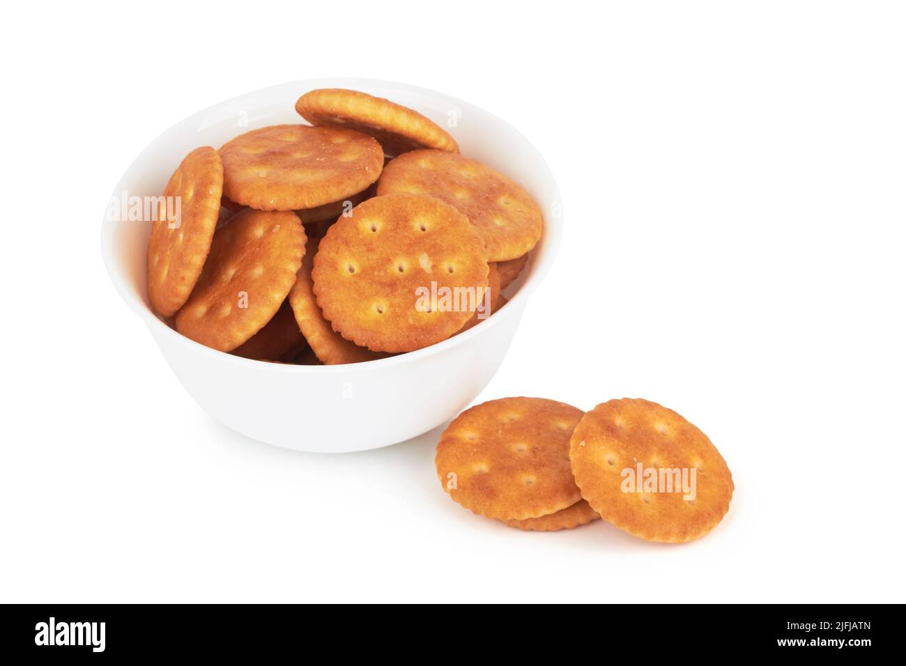 Round salted snack cracker in bowl isolated on white background Stock ...