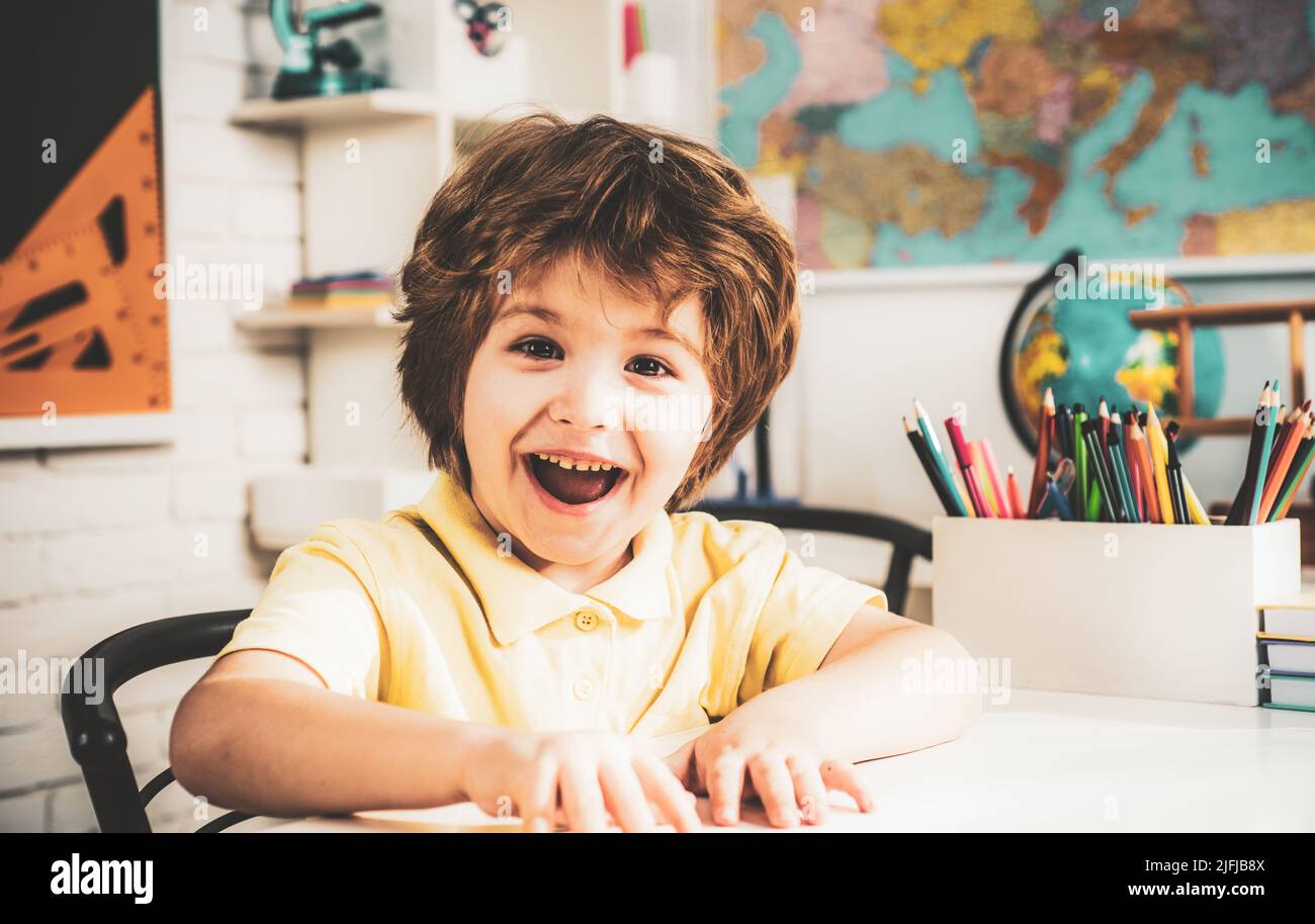 Surprised pupil. Beginning of lessons. Little ready to study. Happy ...