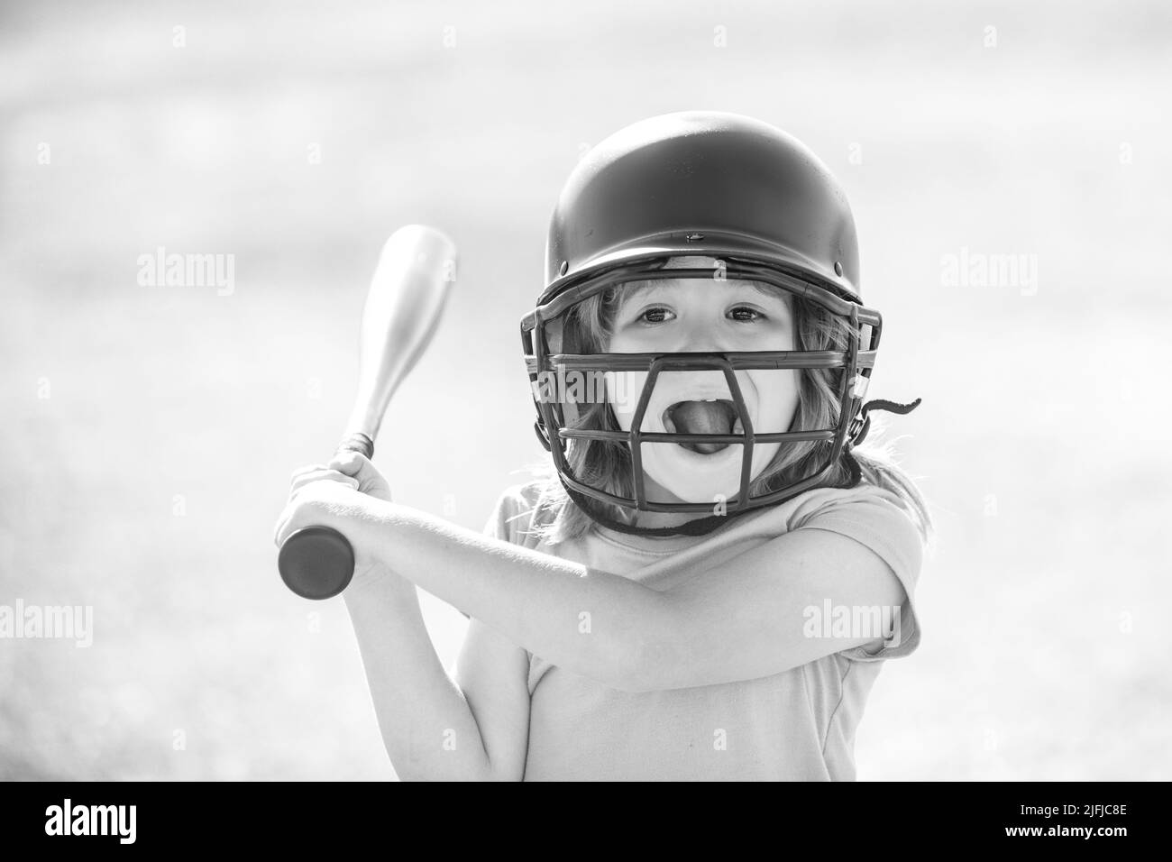 Funny kid up to bat at a baseball game. Close up portrait Stock Photo ...