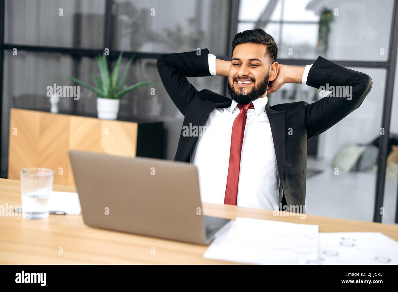 Relaxed calm indian or arabian business man, top manager, chilling at ...