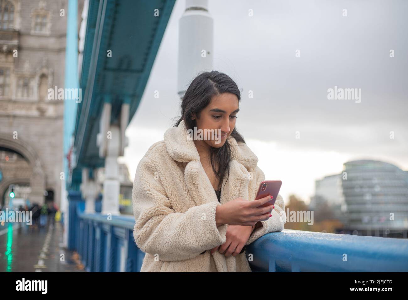 Girl uses her smartphone while in London, millennial person the capital ...