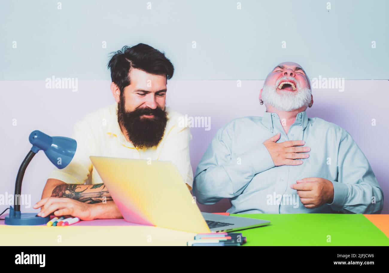 Funny photo of businessman wearing shirt working with laptop at table ...