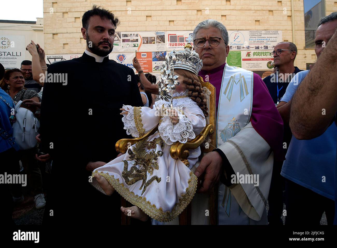 Matera, Italy. 02nd July, 2022. A priest shows a statue of baby Jesus ...