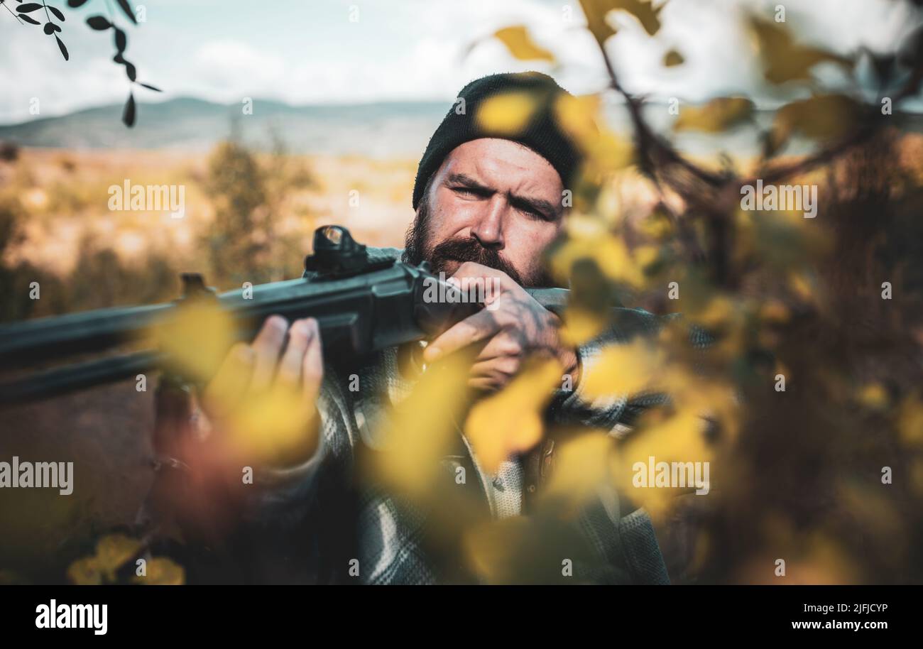 Close up snipers carbine at the outdoor hunting. Man holding shotgun ...