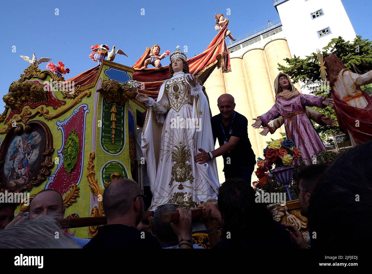The statue of the Madonna della Bruna is placed on the triumphal ...