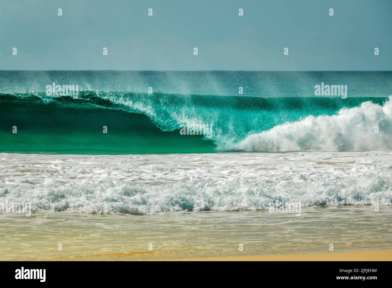 Sea wave breaking Stock Photo - Alamy