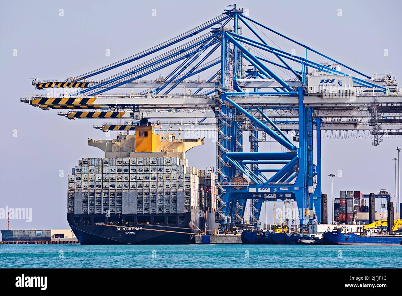 Port activities, big container ship discharging and loading in freeport ...