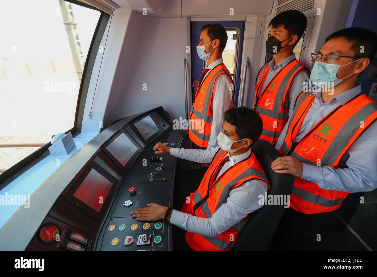 Cairo, Egypt. 3rd July, 2022. An Egyptian train driver operates a light ...