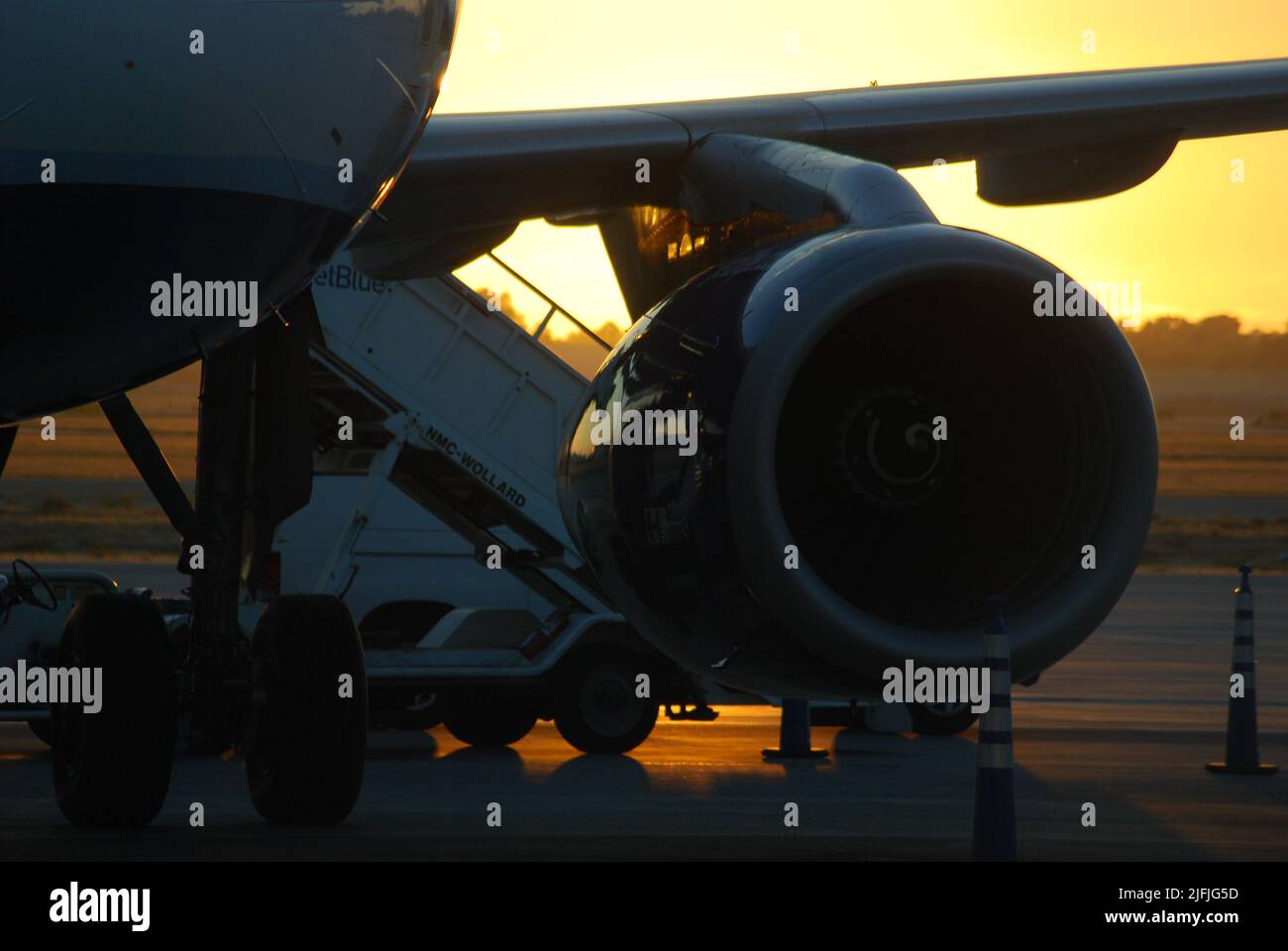 Jet sitting at an airport gate, ready to board Stock Photo - Alamy