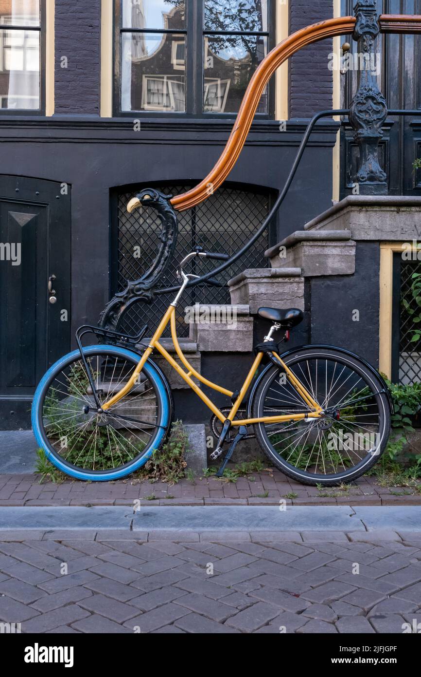 Yellow and blue bike in Amsterdam, Netherlands Stock Photo - Alamy