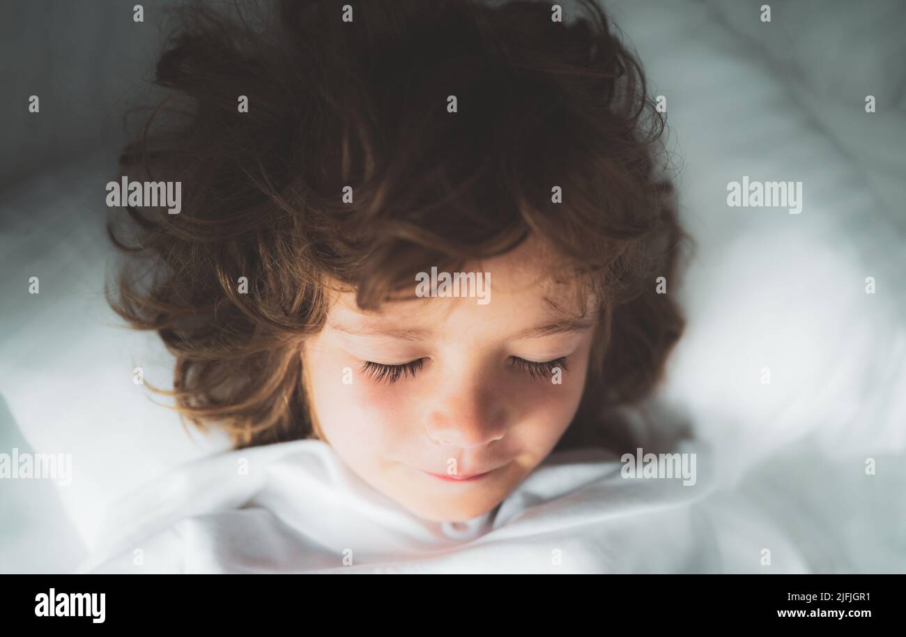 Adorable kids sleep. Child on sleeping bed, happy bedtime in white ...