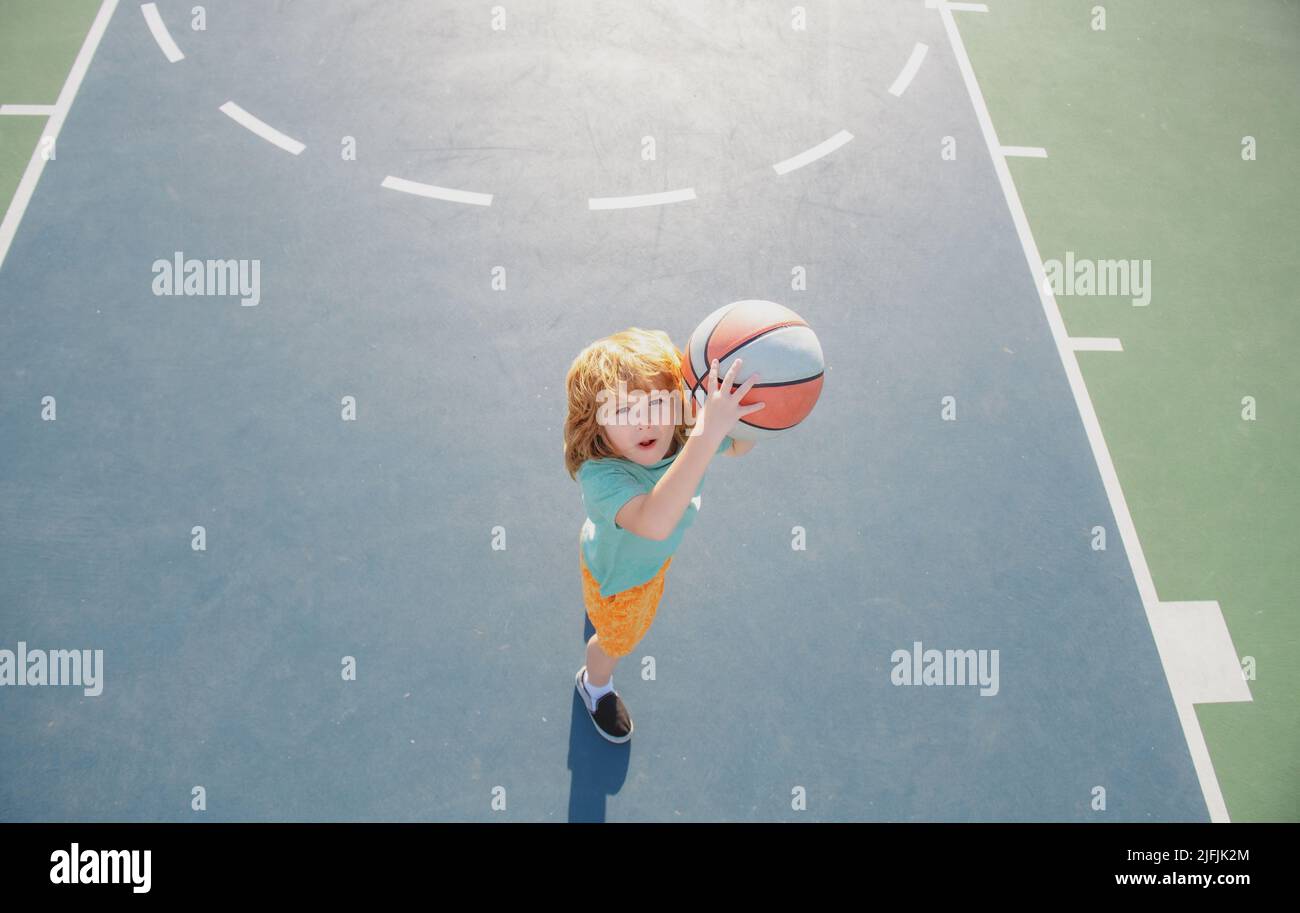 Kids playing basketball, outdoor on playground. Child sport activity ...