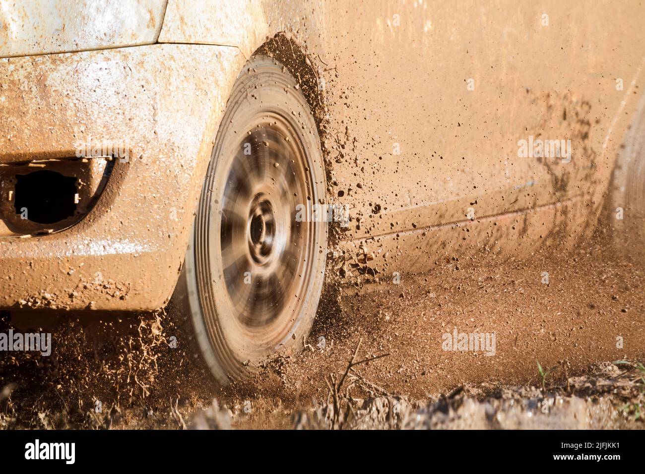 Rally car in muddy road Stock Photo - Alamy