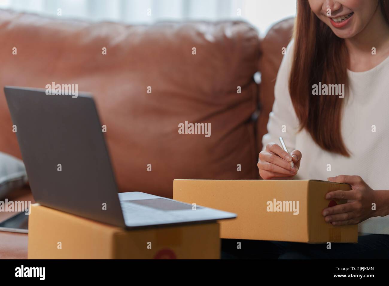 Image of Young asian woman startup freelance with parcel box and ...