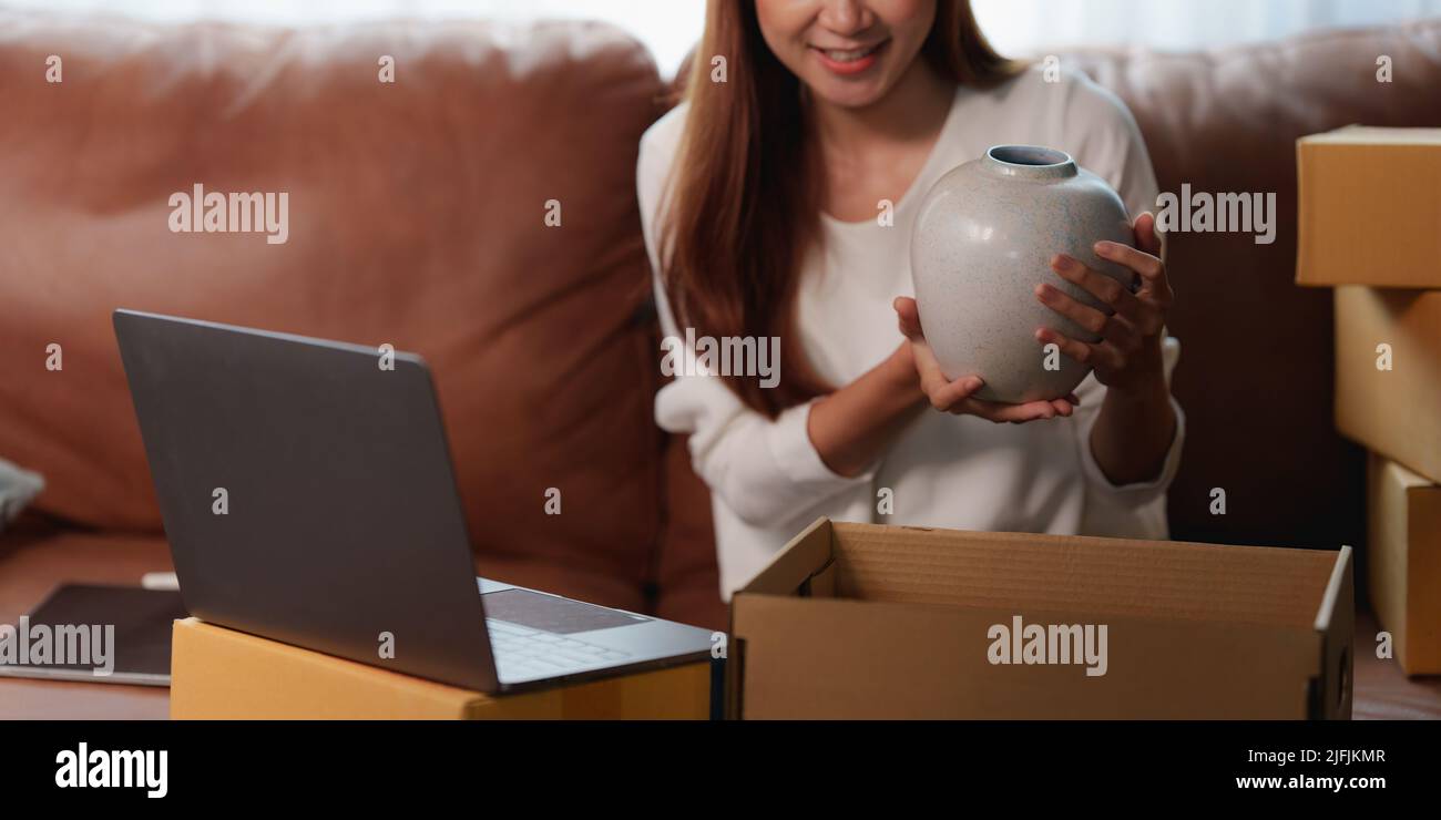 Image of Young asian woman startup freelance with parcel box and ...