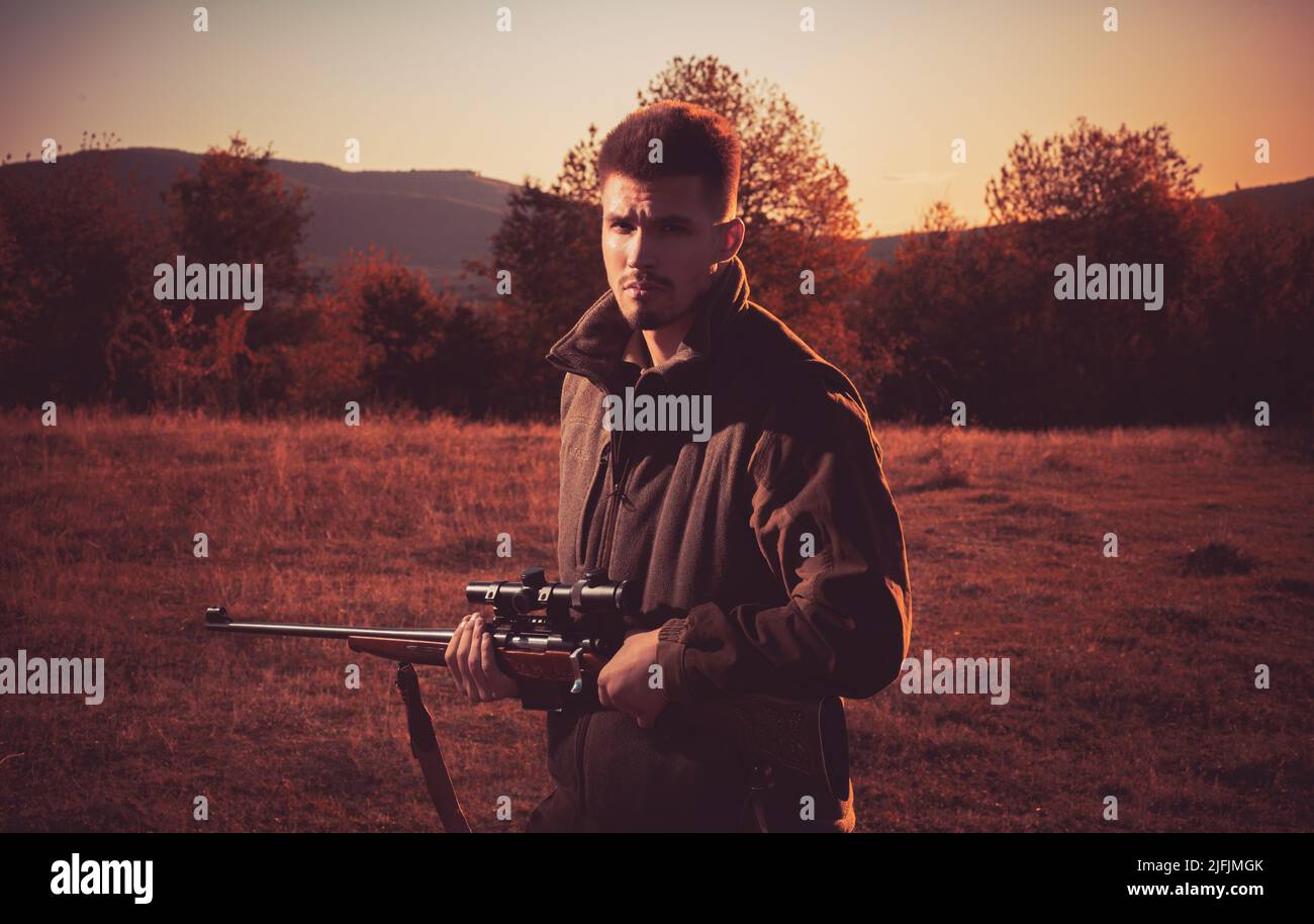 Hunter with shotgun gun on hunt. Illegal Hunting Poacher in the Forest ...