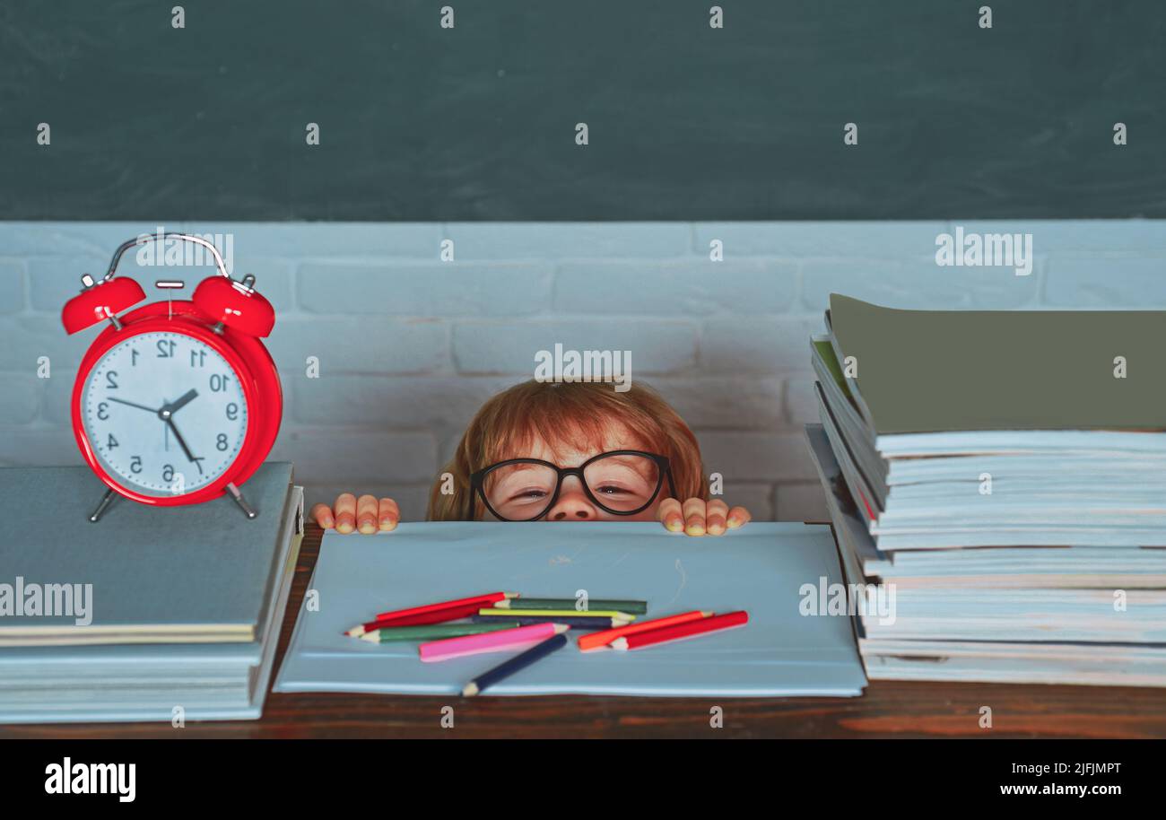 Time to learn concept. School kids against green chalkboard. Learning ...