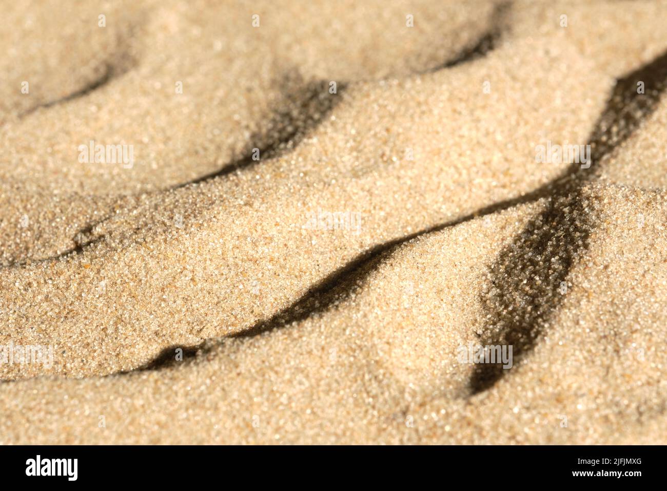 Beach sand forming natural ripples, minimalist textured background for ...