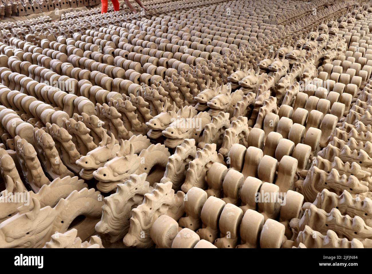 ZAOZHUANG, CHINA - JULY 3, 2022 - A folk artist checks the dry ...