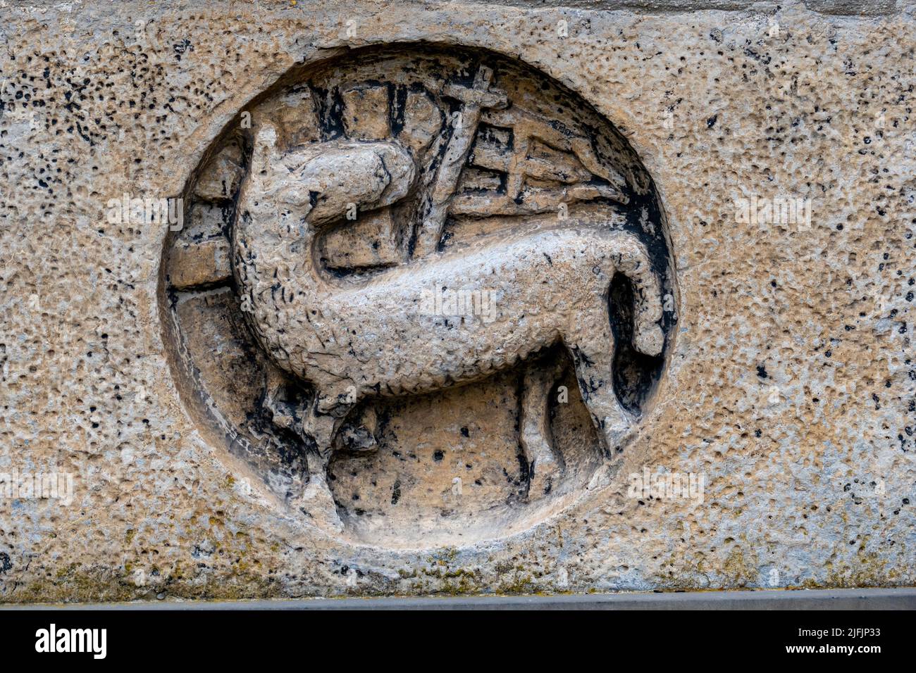 A closeup of animal slate bas-relief on stony wall Stock Photo - Alamy
