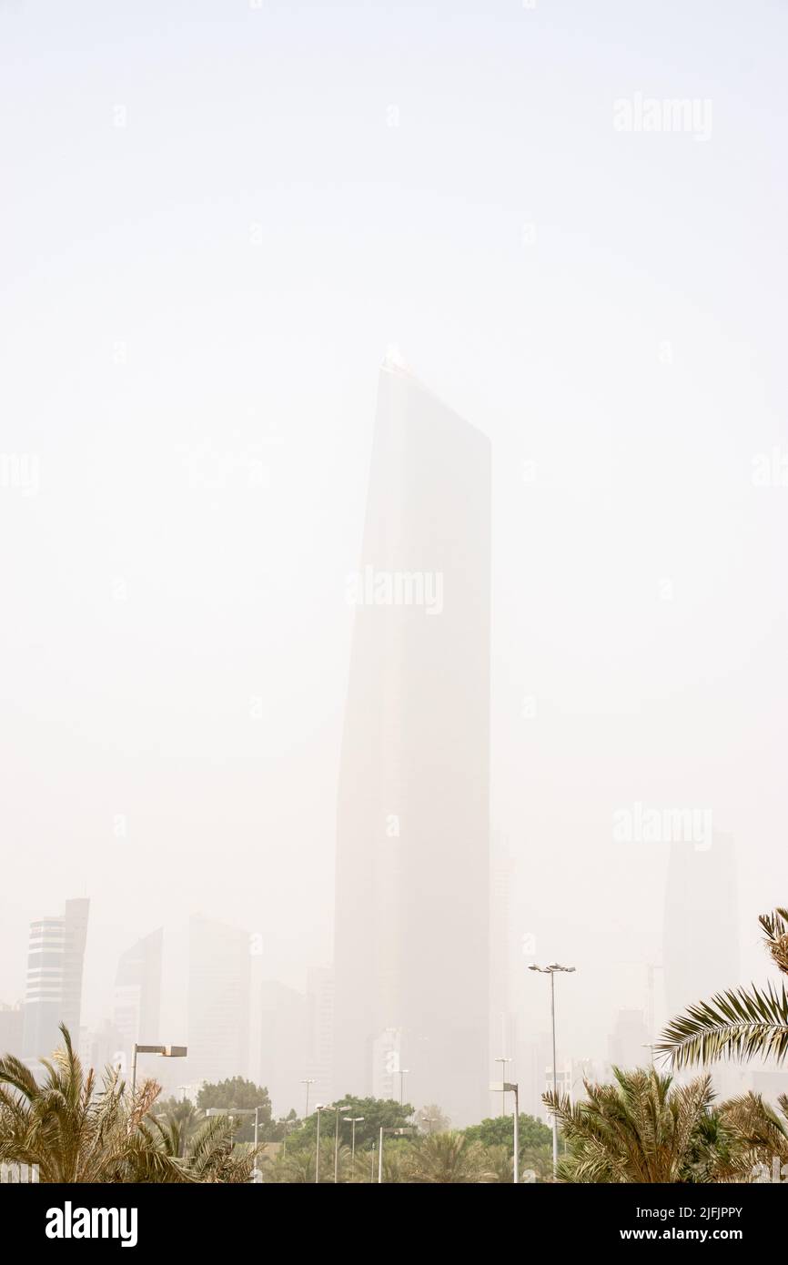 A high rise tower in Kuwait City during a duststorm with poor ...