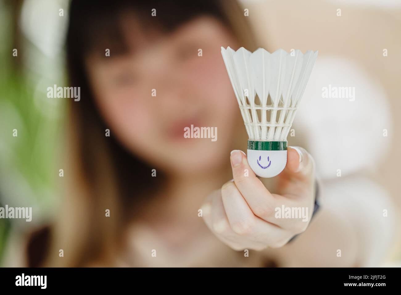 closeup blur people hand holding Badminton Shuttercock with Happy ...