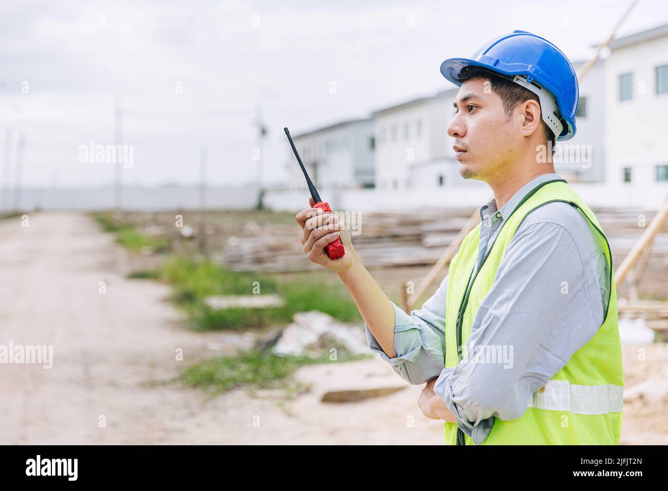 worker foreman engineer builder working using radio command in home ...