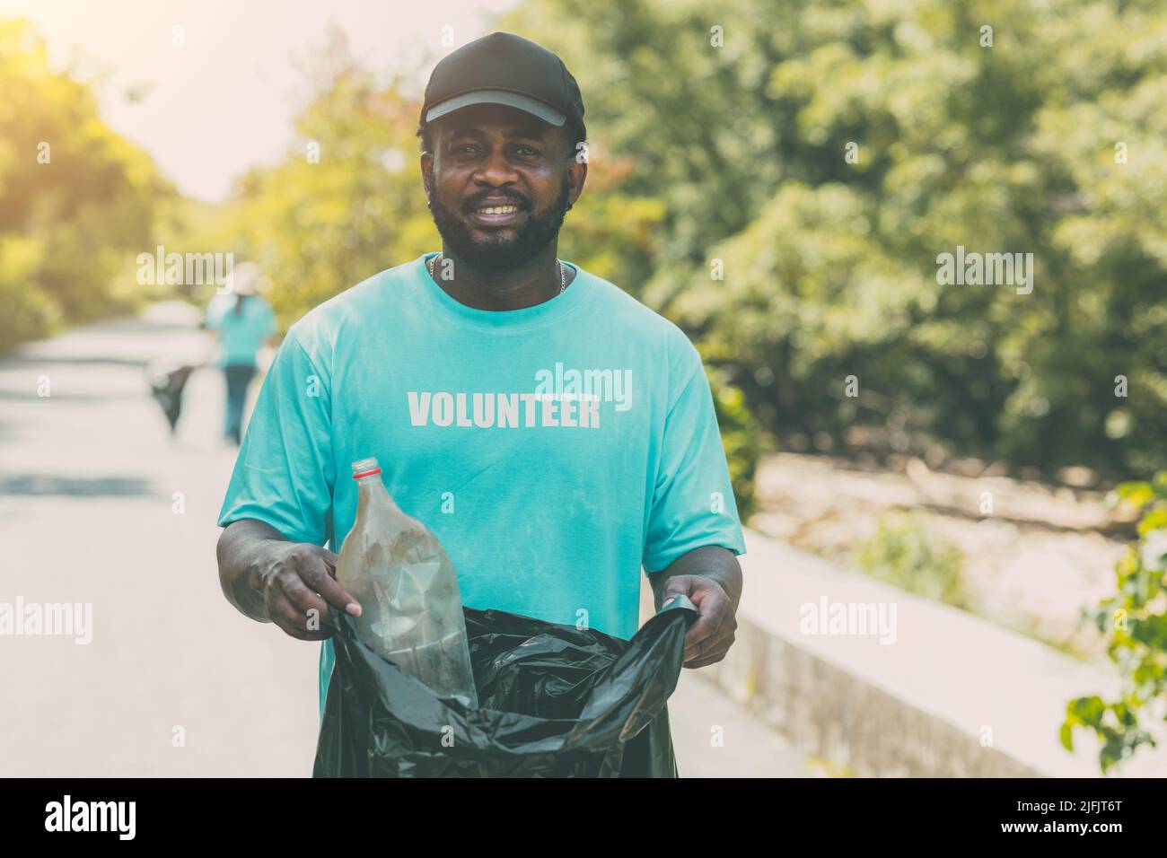 Portrait Volunteer black people Cleanup waste plastic bottle garbage ...