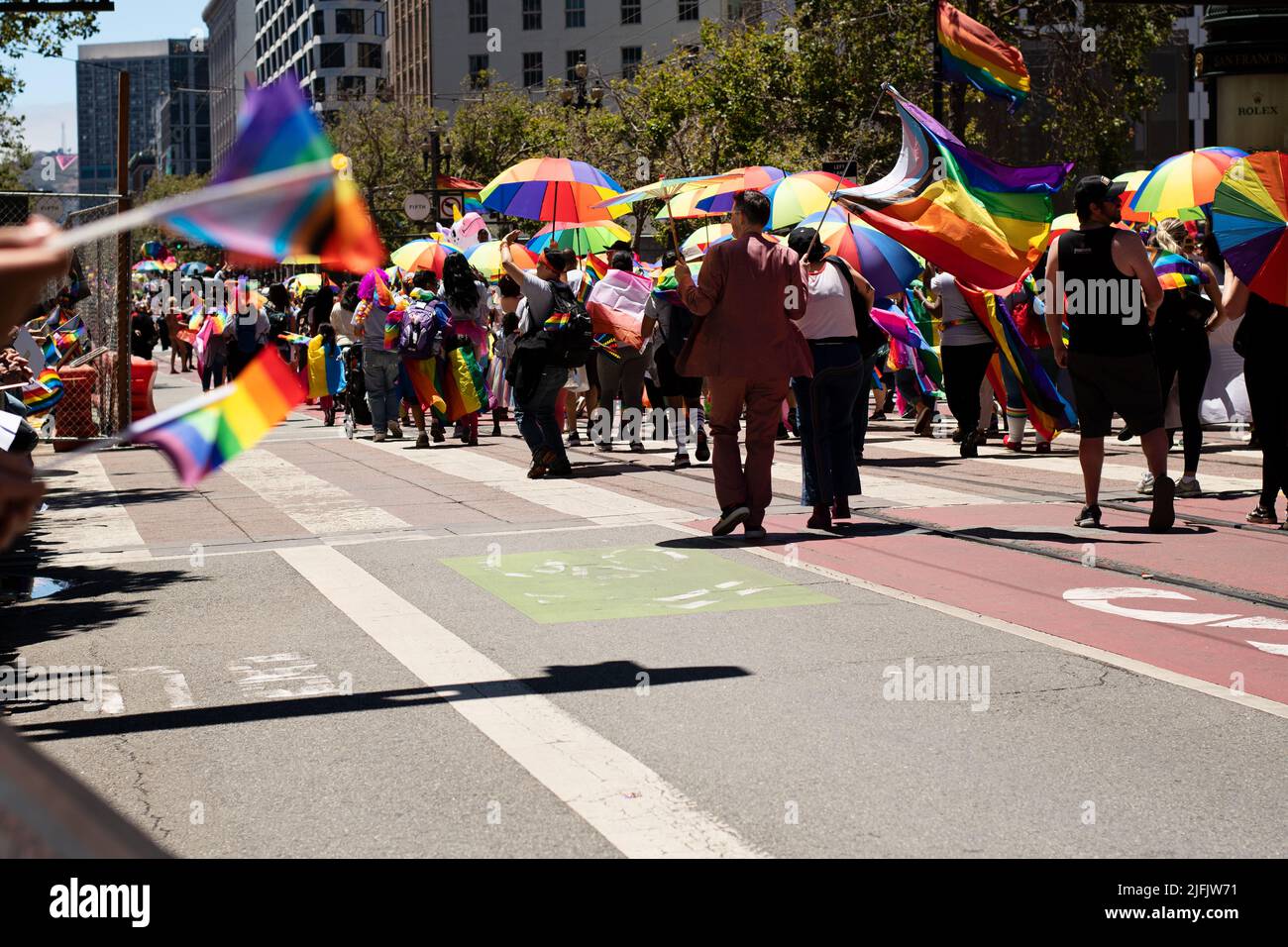 Supporters and spectators waving with the pride rainbow flag and the ...