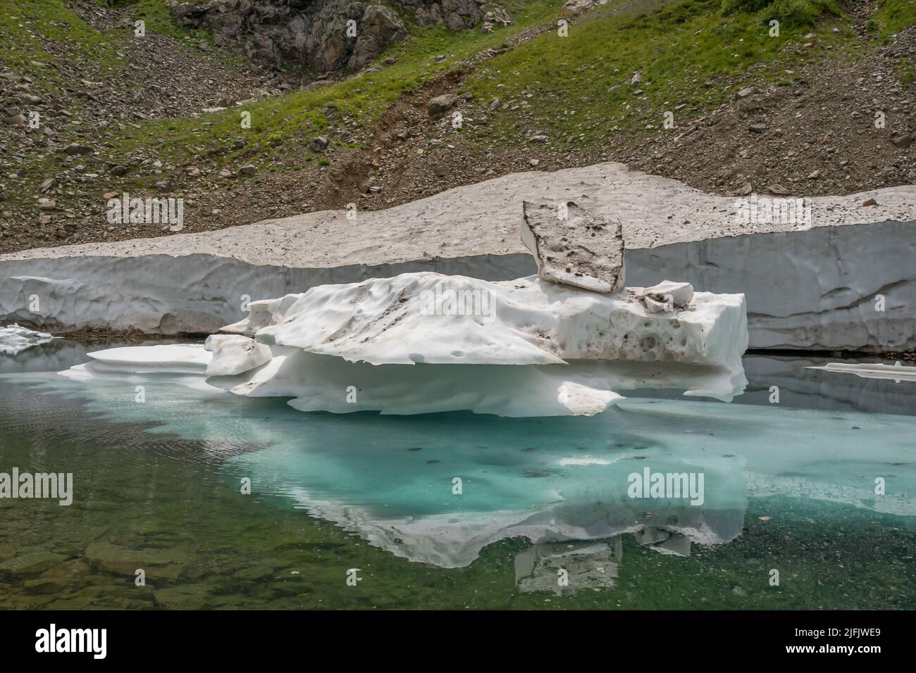 View of the Blue ice melts in a mountain lake Stock Photo - Alamy