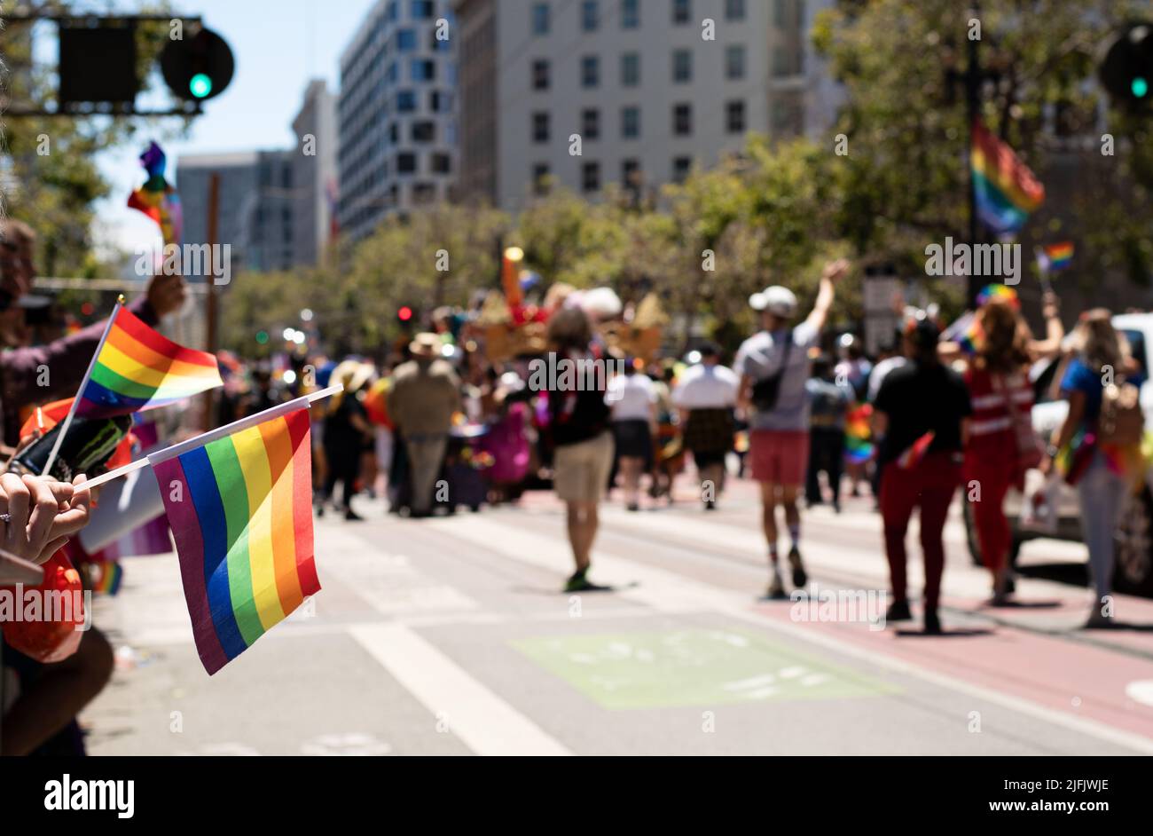 Supporters waving with pride flags as they are watching the pride ...