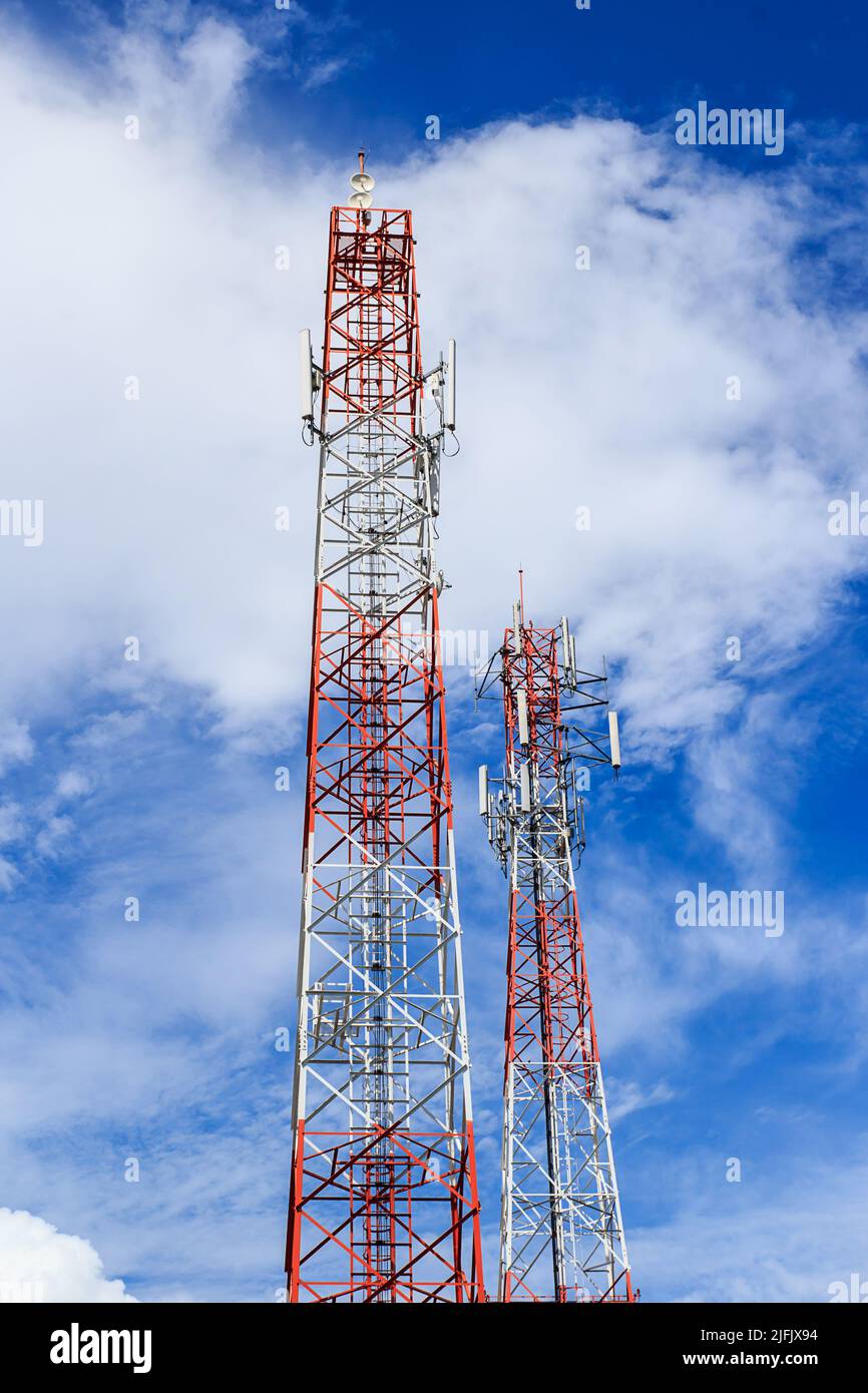 Antenna and cellular tower in blue sky background Stock Photo - Alamy