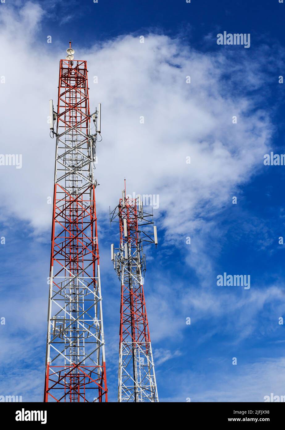 Antenna and cellular tower in blue sky background Stock Photo - Alamy